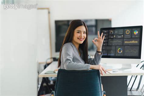 Professional Data Analyst Using Data Visualizations Dashboard On Computer Monitor For Data