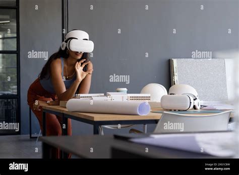 Using Vr Headset Woman Exploring Architectural Model In Modern Office Workspace Copy Space