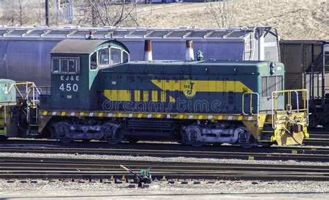 a railroad classification yard is filled with freight cars and ejande 450