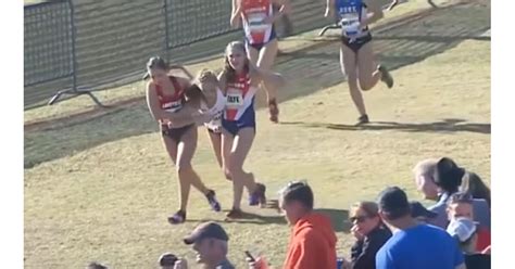 Two Runners Stop To Help Collapsed Girl Over The Finish Line In Acc Race