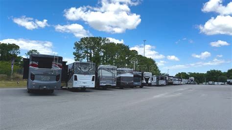 A Row Of Various Class A Motorhomes At A General Rv Showroom Stock Footage Video Of Camper