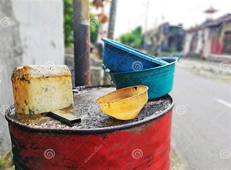 Drums And Buckets For Used Oil Storageplaced On The Side Of The Road