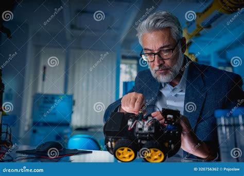 Automation Robotics Engineer Assembling Robotic Car Concept Of Modern Technology In Industries