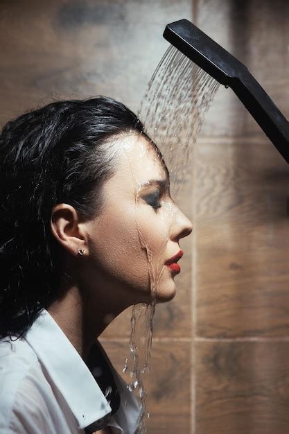 Premium Photo Woman In A Shower With A Shower Head