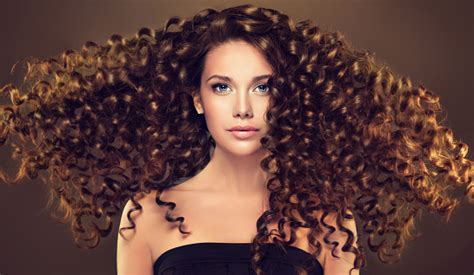 Young Brown Haired Beautiful Model With Long Wavy Well Groomed
