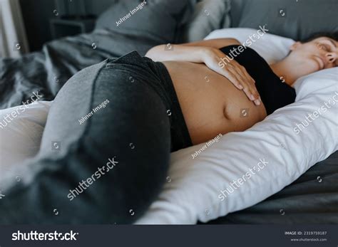 Pregnant Woman Sleeping On The Bed With A Pillow Over 1 920 Royalty