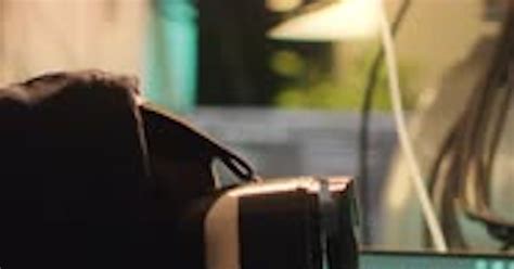 Vertical Video Cyber Criminal Using Virtual Reality Haeadset To Hack Computer Firewall Stock