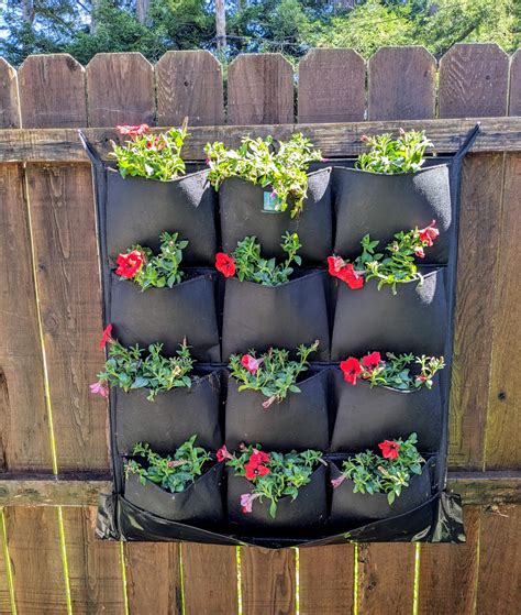 Diy Vertical Garden In Pockets 21 Vertical Gardens Thatll Give Life