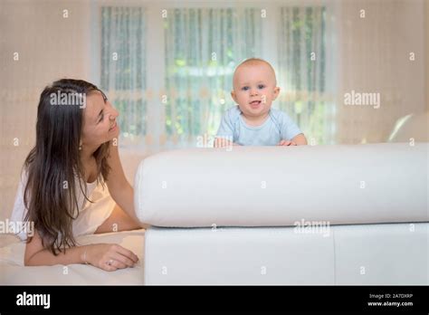 Cheerful Mom Is Enjoying Playing With Her Son While They Are Located On