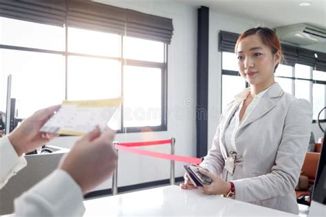 beautiful asian woman traveler standing at check in area airport