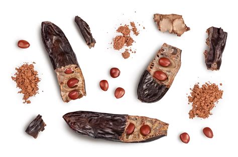 Carob Pod And Powder Isolated On A Food And Drink Photo By Nataphoto