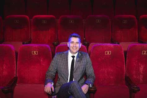 Premium Photo Portrait Of A Young Handsome Man Alone In A Movie Theater In A Business Suit