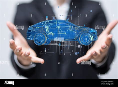 A Mans Hands Holding A 3d Rendering Of An Autonomous Driving Electric Car With Binary Codes
