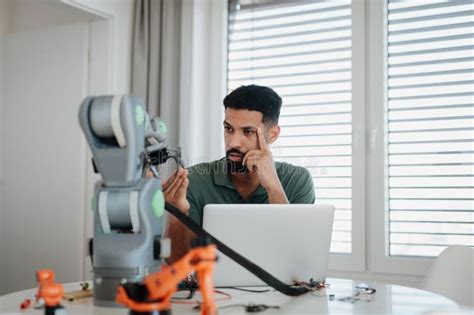 Engineer Struggling With A Technical Problem While Building Robotic Arm
