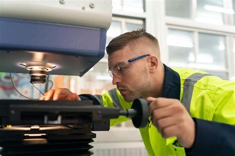 Premium Photo Engineer Check And Control Automation Robot Arms Machine In Intelligent Factory