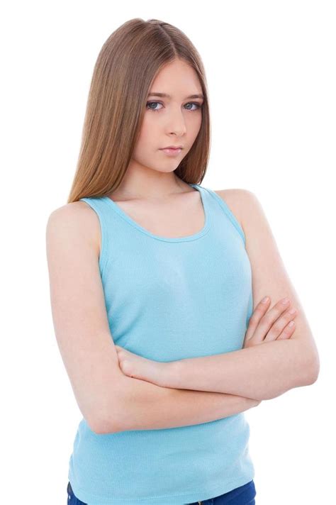 Difficult Age Sad Young Teenage Girl Keeping Arms Crossed And Looking