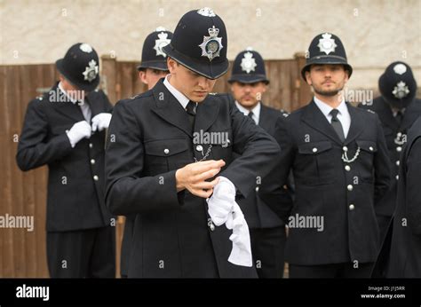 New Metropolitan Police Officers Check Their Uniforms Before Taking