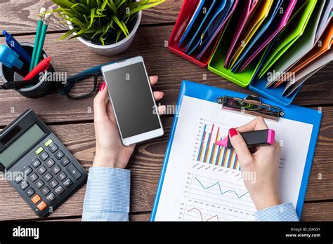 Office Desktop With Graphs And Charts Documents And Modern Digital Devices Business Background