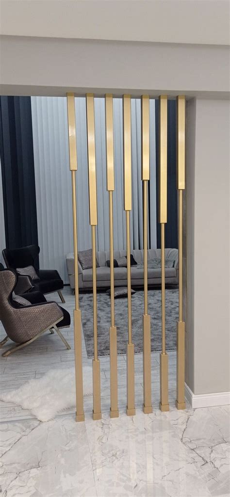 An Elegant Room With Marble Floors And Gold Bars On The Wall In Front