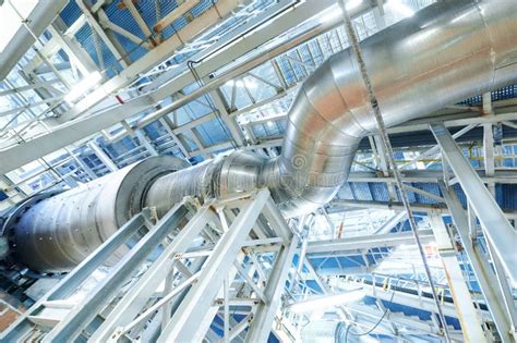 Complex Network Of Steel Pipelines Within A Chemical Plant Showcasing Industrial Processes And