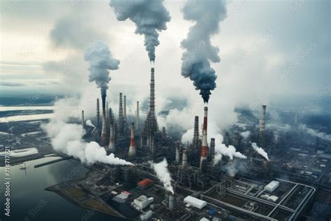 Air Pollution Smoke From Oil Refinery With Tower And Pipeline Stock