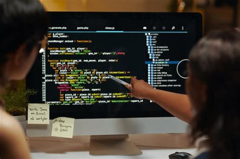 Premium Photo Developers Pointing At Programming Code