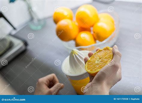 Squeezing Orange Juice by Hand Stock Photo - Image of breakfast, healthy: 161175928