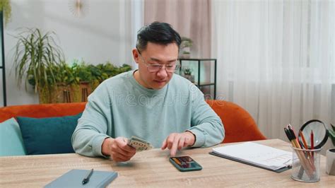 Rich Happy Indian Man Counting Money Cash On Smartphone Calculator App Calculate Income