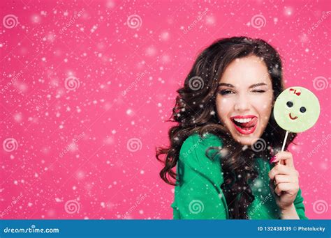 Beautiful And Smiling Brunette Woman Holding Posing With Sweet Candy