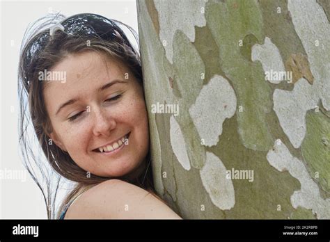 Woman Hugging Large Tree Stock Photo Alamy