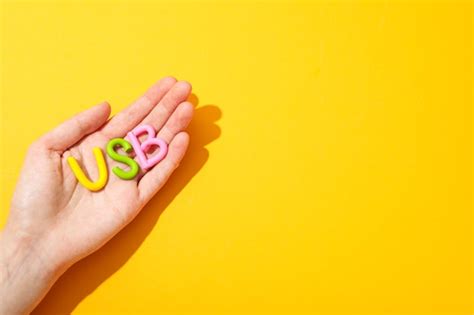 Premium Photo The Word USB In Hands Made Of Colored Plasticine