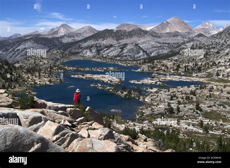 Hiker Stops To Look Out Over Marie Lakes From Selden Pass Along The