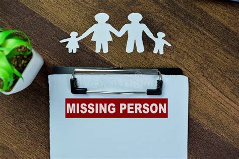 Concept Of Missing Person Write On Paperwork On A Book Isolated On Wooden Table Stock Image