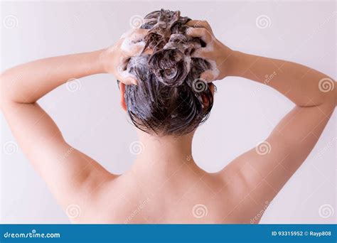 Model Massaging Shampoo into Her Hair, Closeup Profile from the Back ...