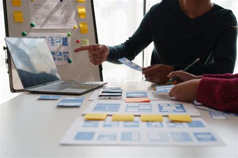 group of ux developer and ui designer brainstorming about app interface