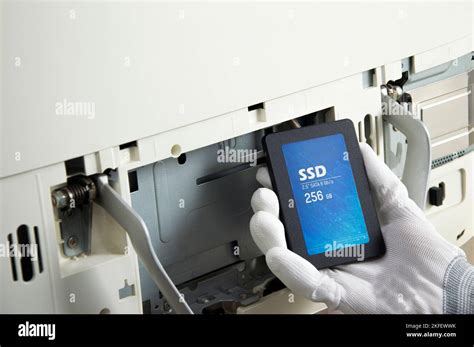 2 5 Inch Ssd Hard Drive That Technician Is Installing In Computer Stock Photo Alamy