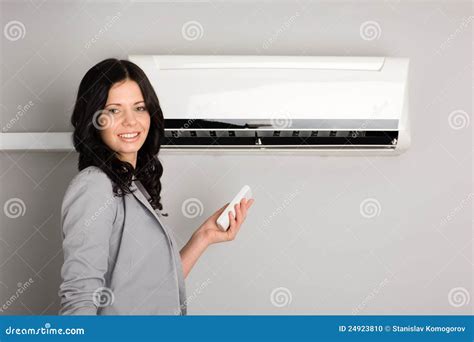 Girl With A Remote Control Air Conditioner Stock Photo Image Of Cool Business