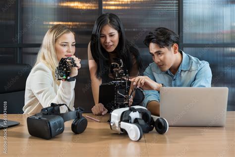 Male And Female Engineer Working With Ai Robot Arm System Project In