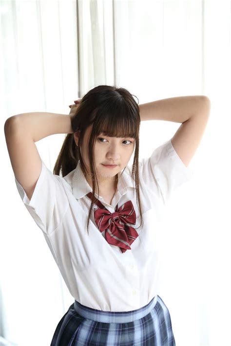 Portrait Japanese School Girl Uniform In White Tone Bed Room Stock