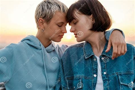 Close Up Of Young Sensual Lesbian Couple Going To Kiss Two Women