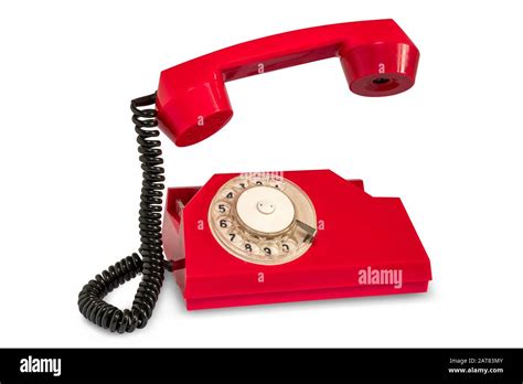 Old Rotary Phone With The Receiver Raised In The Air Isolated On White