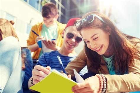 Premium Photo Group Of Students With Notebooks At School Yard