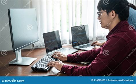 Team Of Asian Programmer Working Together About New Project To