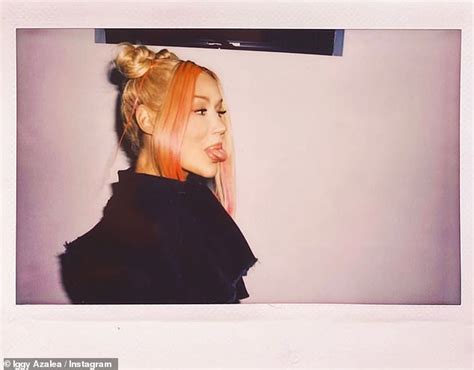 Iggy Azalea Debuts Pink Highlights As She Playfully Sticks Her Tongue Out In Polaroid Style