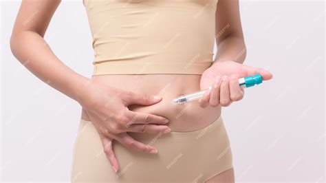 Premium Photo Close Up Woman Using Ivf Treatment Injection On Belly To Prepare Reproductive