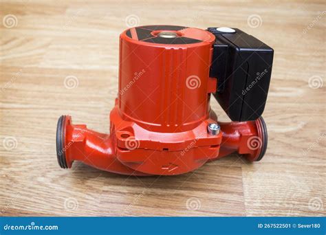 Red Circulation Pump For Heating System Lies On The Floor Stock Image