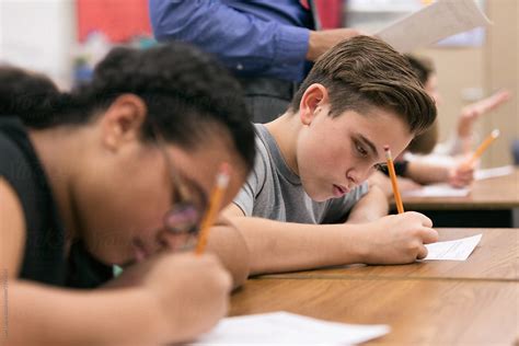 Classroom Students Busy Taking Quiz During Class By Stocksy