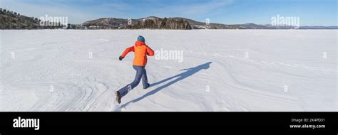 Woman Running On Frozen Lake In Snowy Winter Nature Landscape Winter Fun In Snow Panoramic