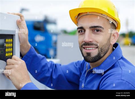 Male Worker Using Electronic Keypad Stock Photo Alamy