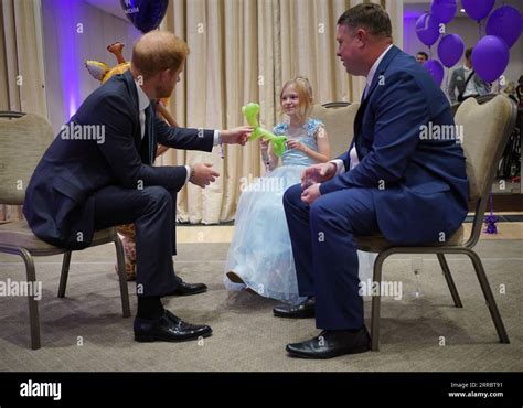 The Duke Of Sussex Speaks To Poppy And Her Father Daniel Higham During